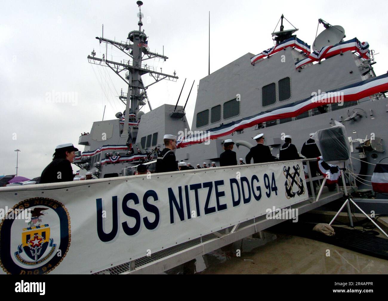 US Navy Sailors board the U.S. Navy's newest Arleigh Burke-class guided ...