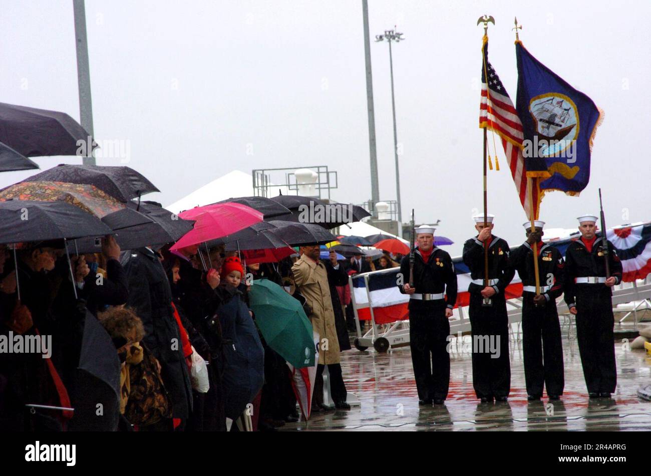US Navy A color guard marches past attendees of the commissioning ...