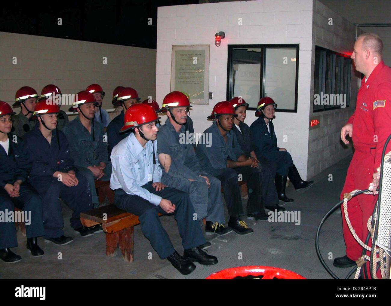 US Navy Damage Controlman 1st Class instructs Sailors on the ...
