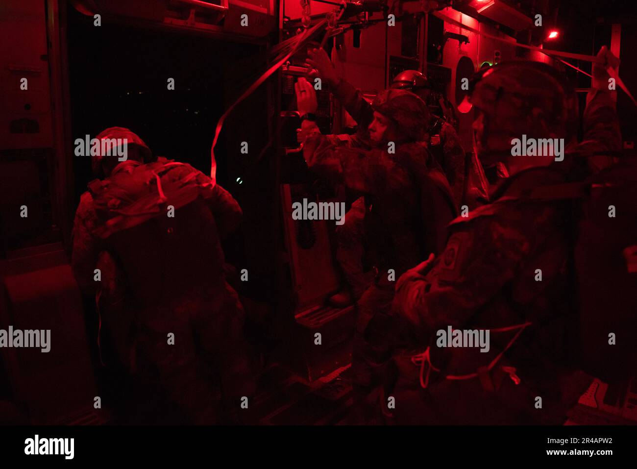 A U.S. Army soldier from the 82nd Airborne Division jumps out of a C-17 ...