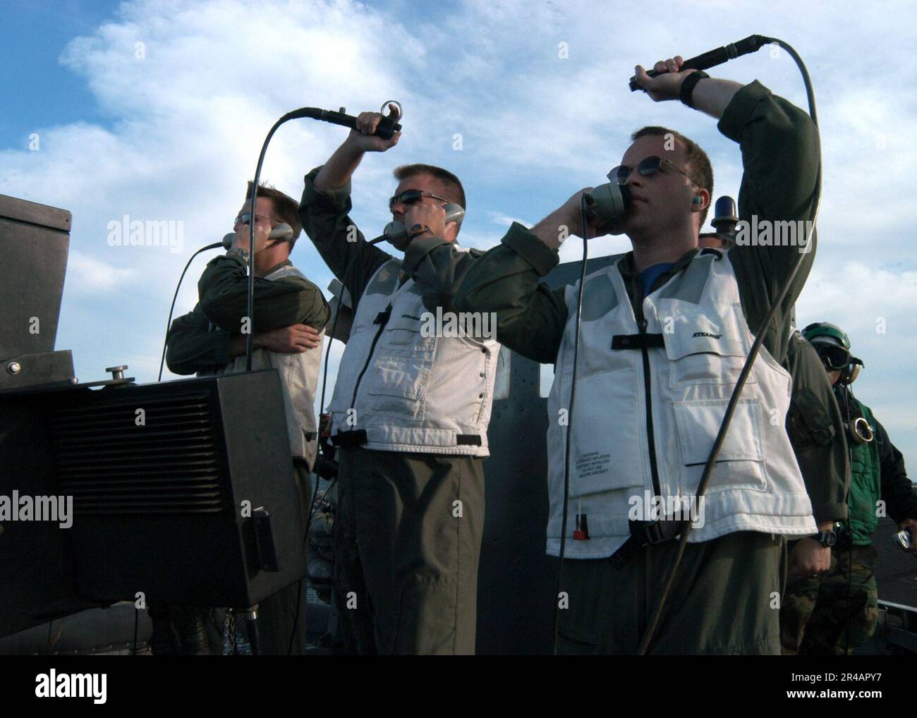 US Navy Landing Signal Officers signal a green deck during flight ...