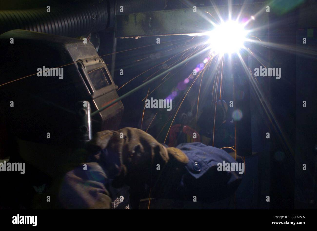 US Navy Hull Maintenance Technician 2nd Class practices arc welding ...