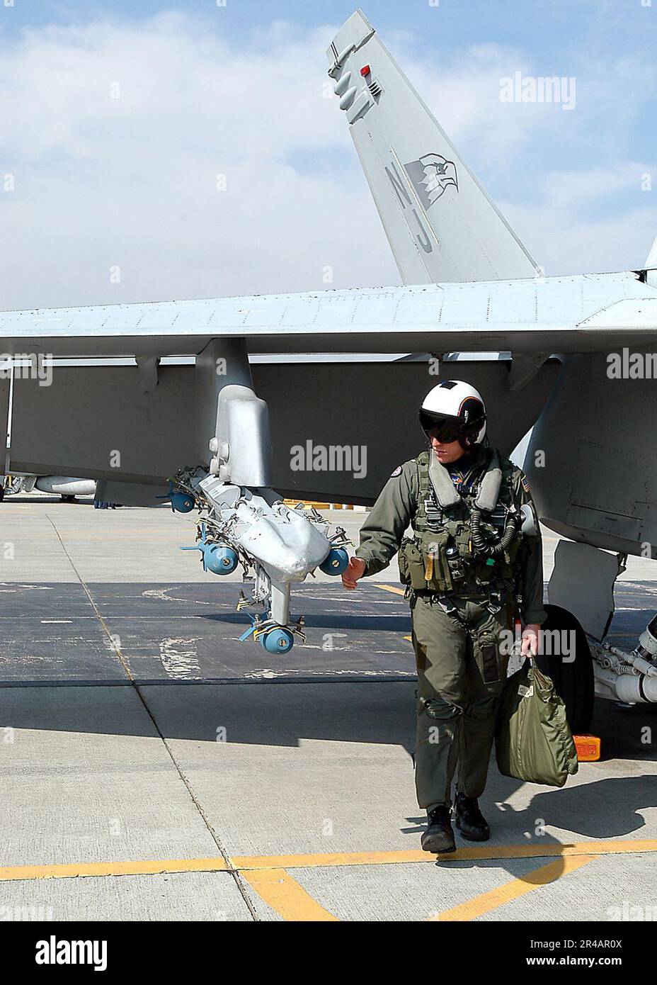 US Navy Lt. conducts pre-flight checks on his F-A-18F Super Hornet ...
