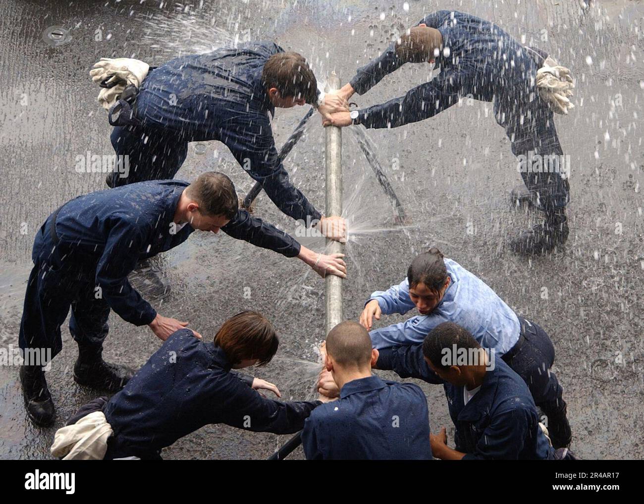 US Navy Sailors participate in pipe patching training on the fantail of ...