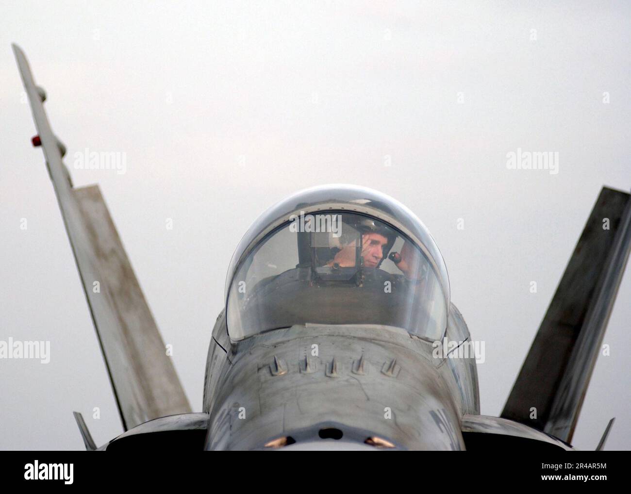 US Navy A pilot salutes the catapult officer from the cockpit of his F ...