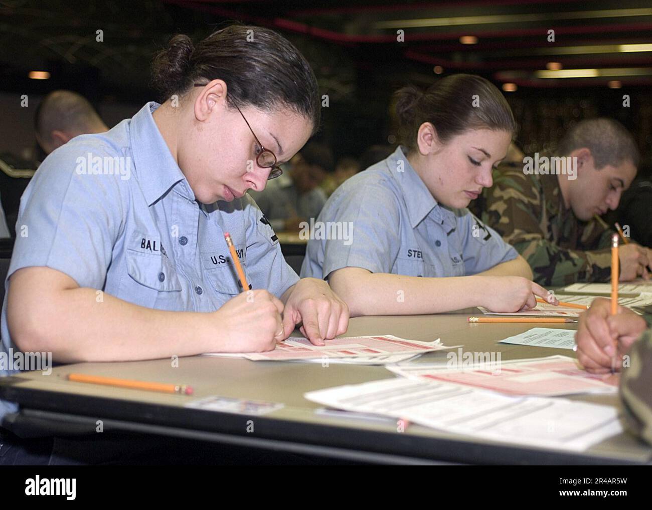 US Navy Hospital Corpsman 3rd Class prepares her answer sheet prior to ...