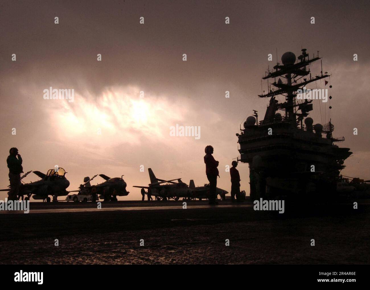 US Navy Sailors stand by on the flight deck prior to the commencement ...