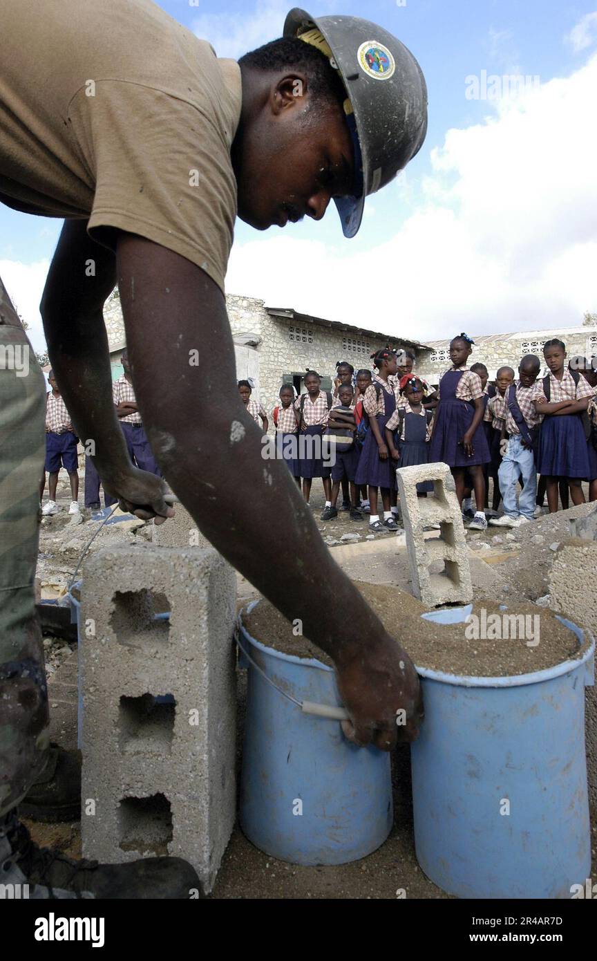 US Navy Builder Constructionman assigned to Naval Mobile Construction ...