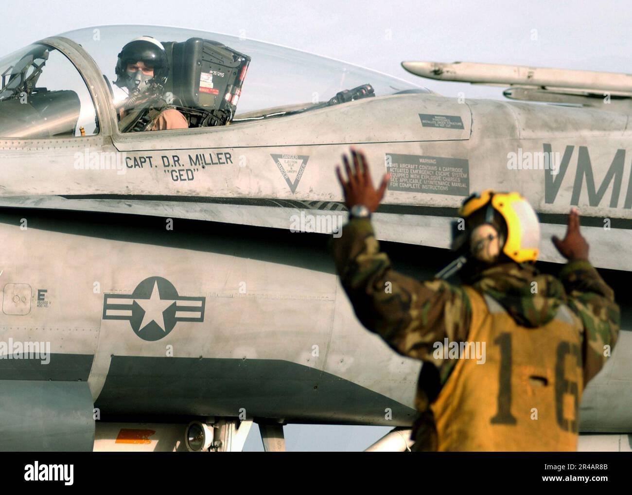US Navy A U.S. Marine Corps pilot follows the directions given by an ...