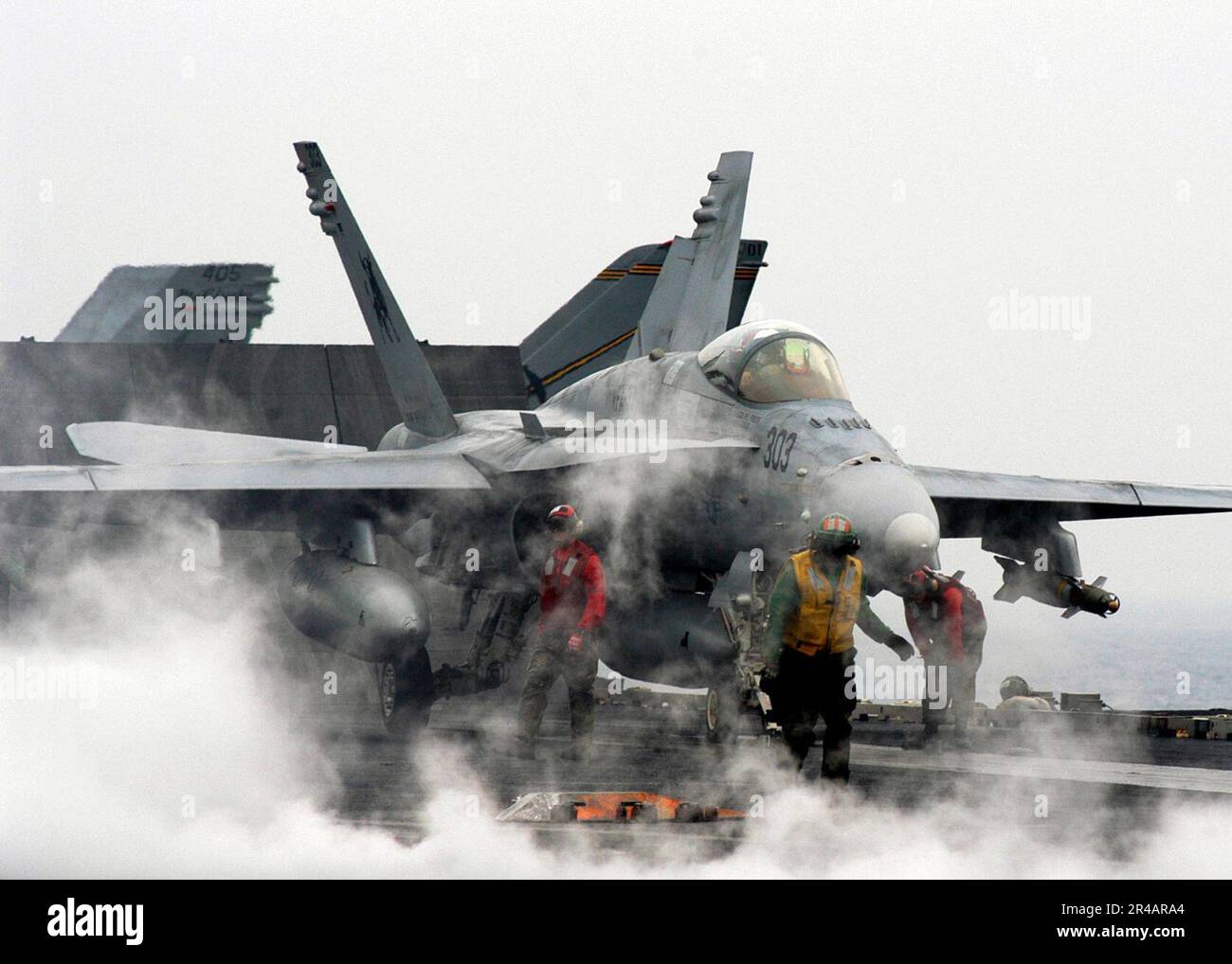 US Navy Squadron troubleshooters and ordnance personnel perform final ...