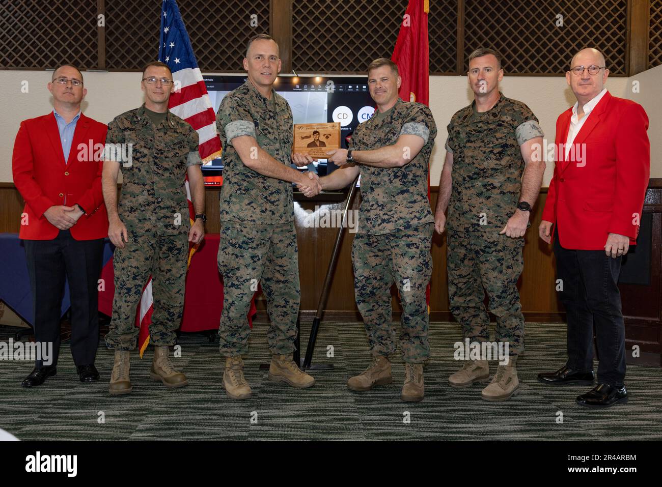 U.S. Marines from Marine Air Control Squadron (MACS) 4 accept a plaque ...