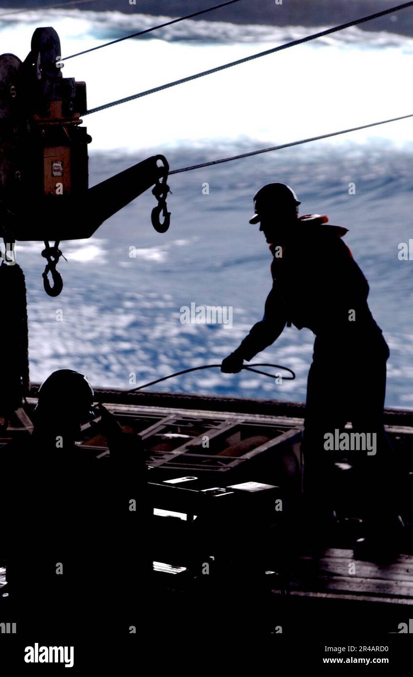 US Navy During a Vertical Replenishment (VERTREP), crew members aboard ...