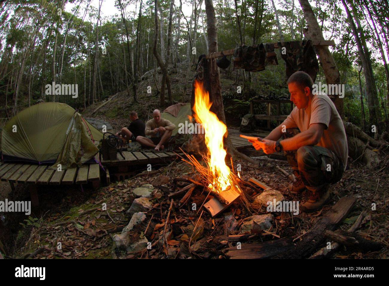 US Navy Lt. starts a fire with fellow Sailors assigned to Explosive ...