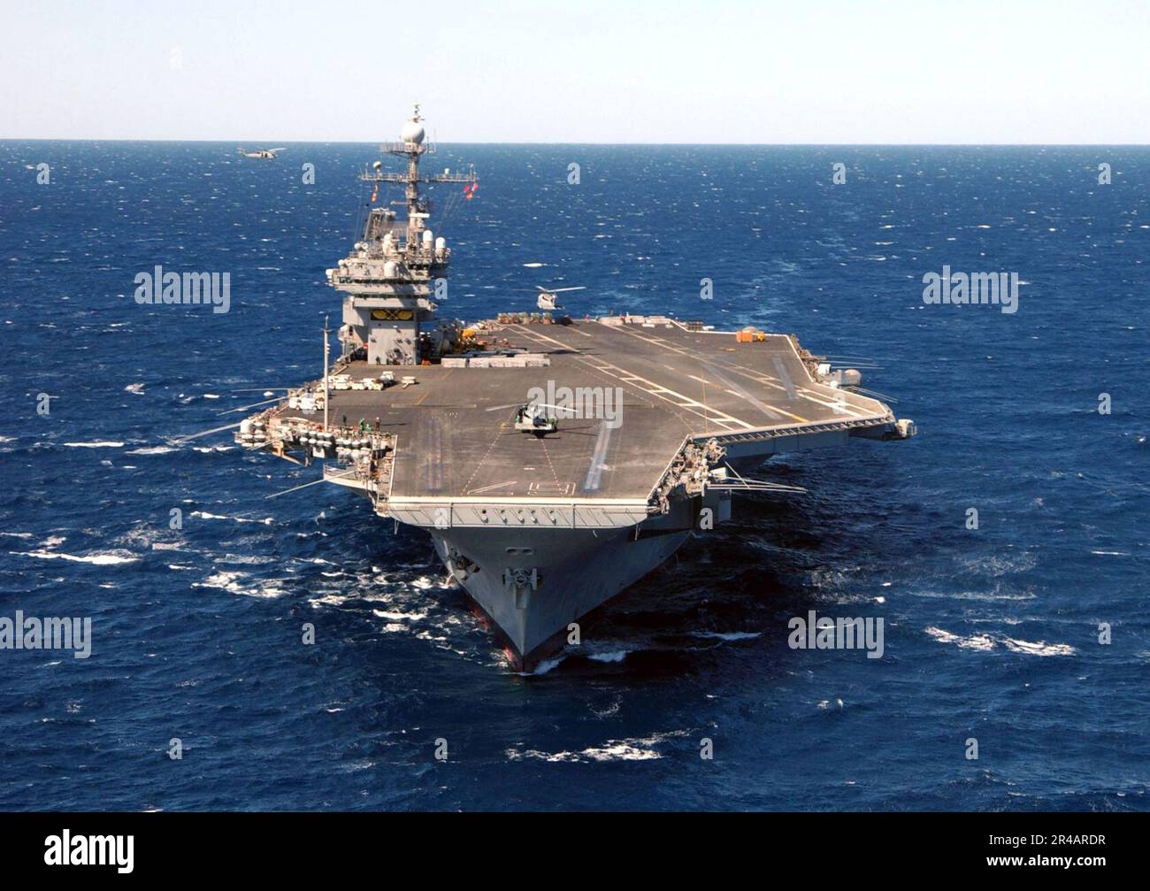 US Navy USS John F. Kennedy (CV 67) conducts a vertical replenishment ...