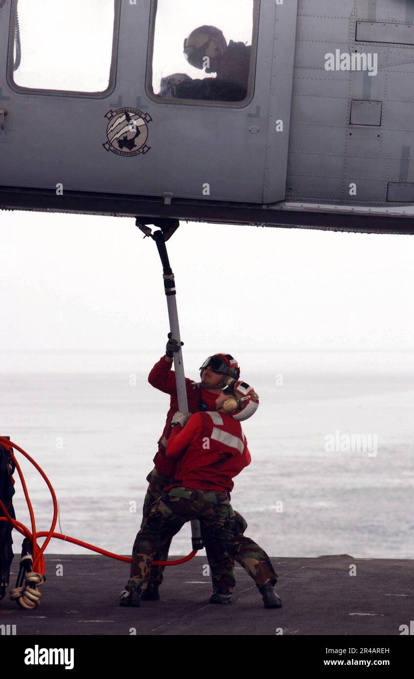 US Navy During a Vertical Replenishment (VERTREP), crew members aboard ...