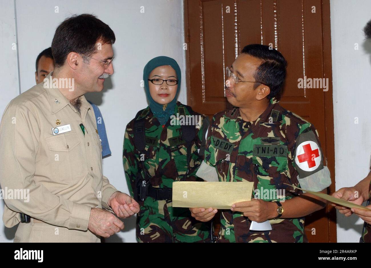 US Navy Commanding Officer, Medical Treatment Facility, Capt. presents ...