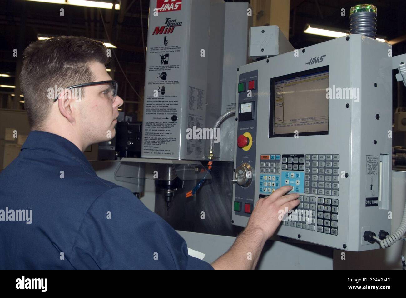 US Navy Machinery Repairman 3rd Class programs the Haas Tool Room Mill ...