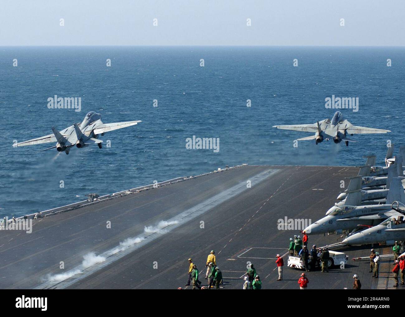 US Navy Two F-14B Tomcats launch in tandem from the waist and bow steam ...