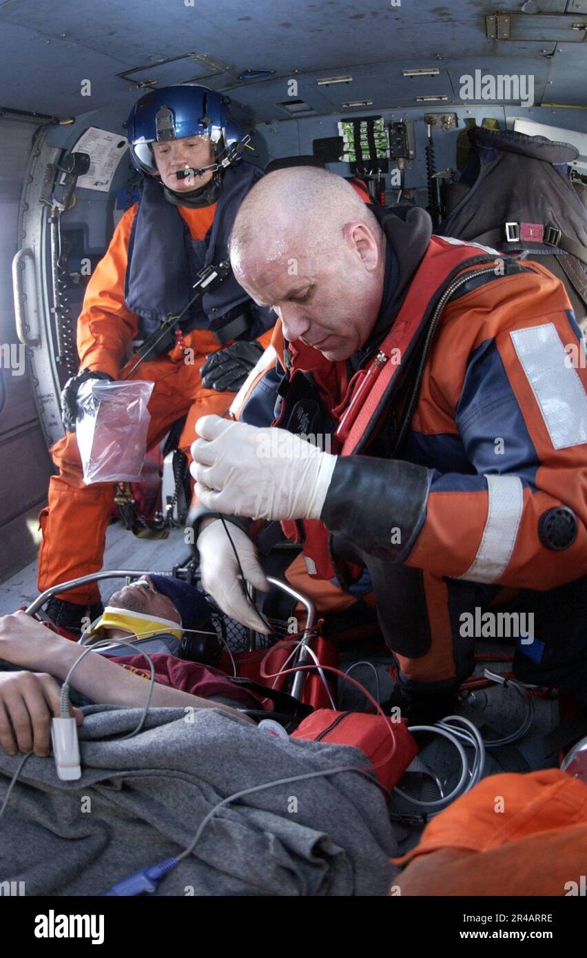 US Navy U.S. Coast Guard Petty Officer 1st Class a rescue swimmer ...