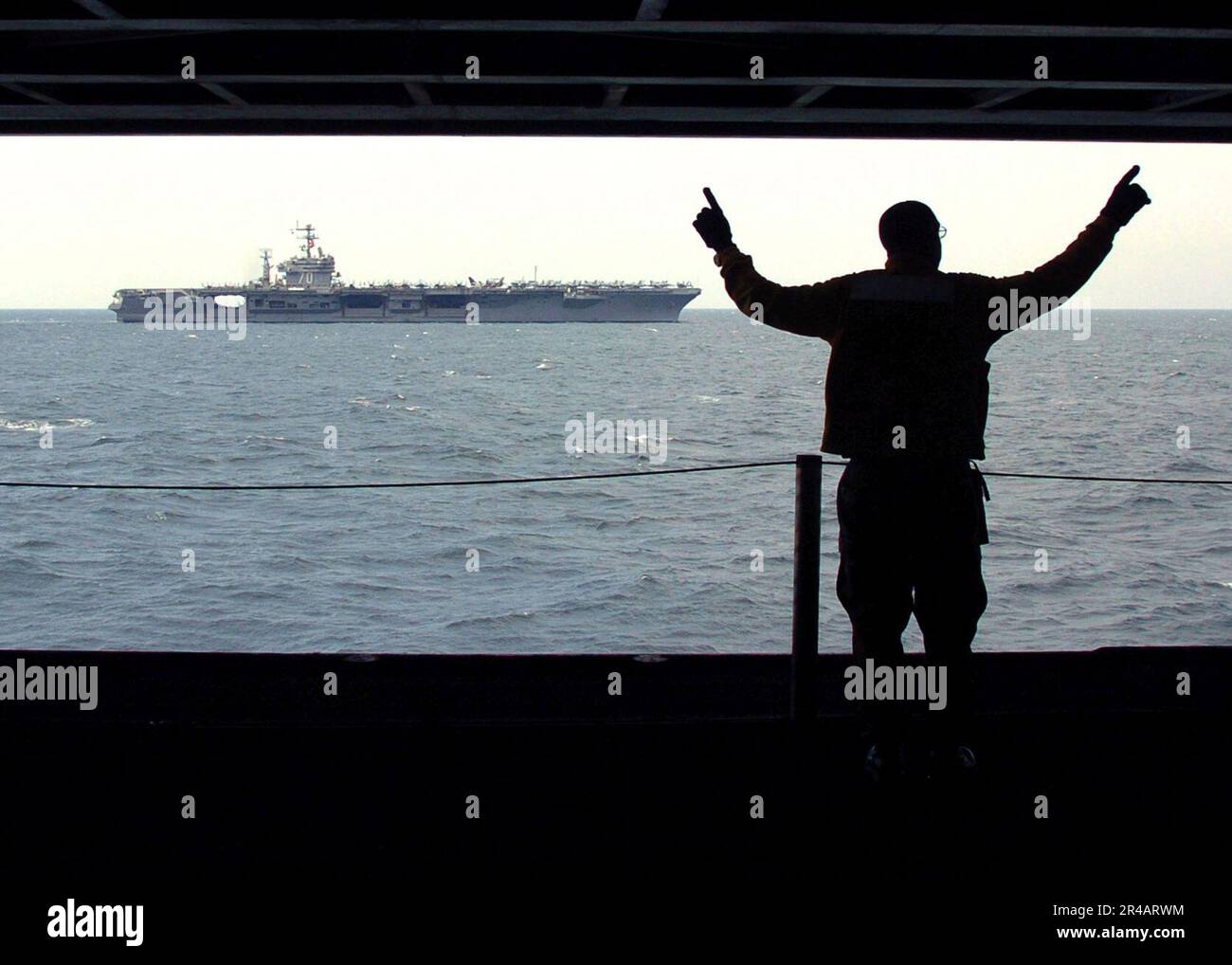 US Navy A Sailor in the hangar bay aboard the Nimitz-class aircraft ...