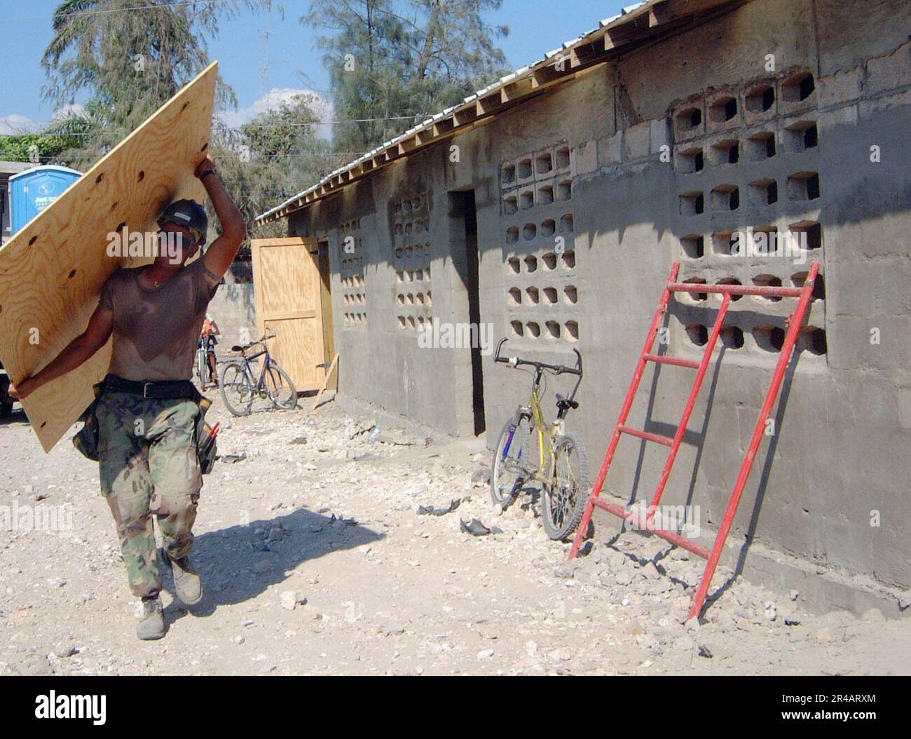 US Navy Builder 2nd Class a Seabee assigned to Naval Mobile ...