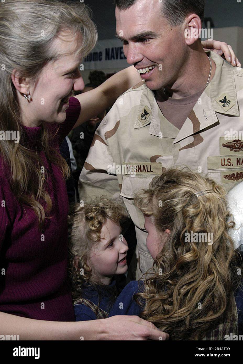 US Navy Storekeeper 1st Class is greeted by his loved ones after ...
