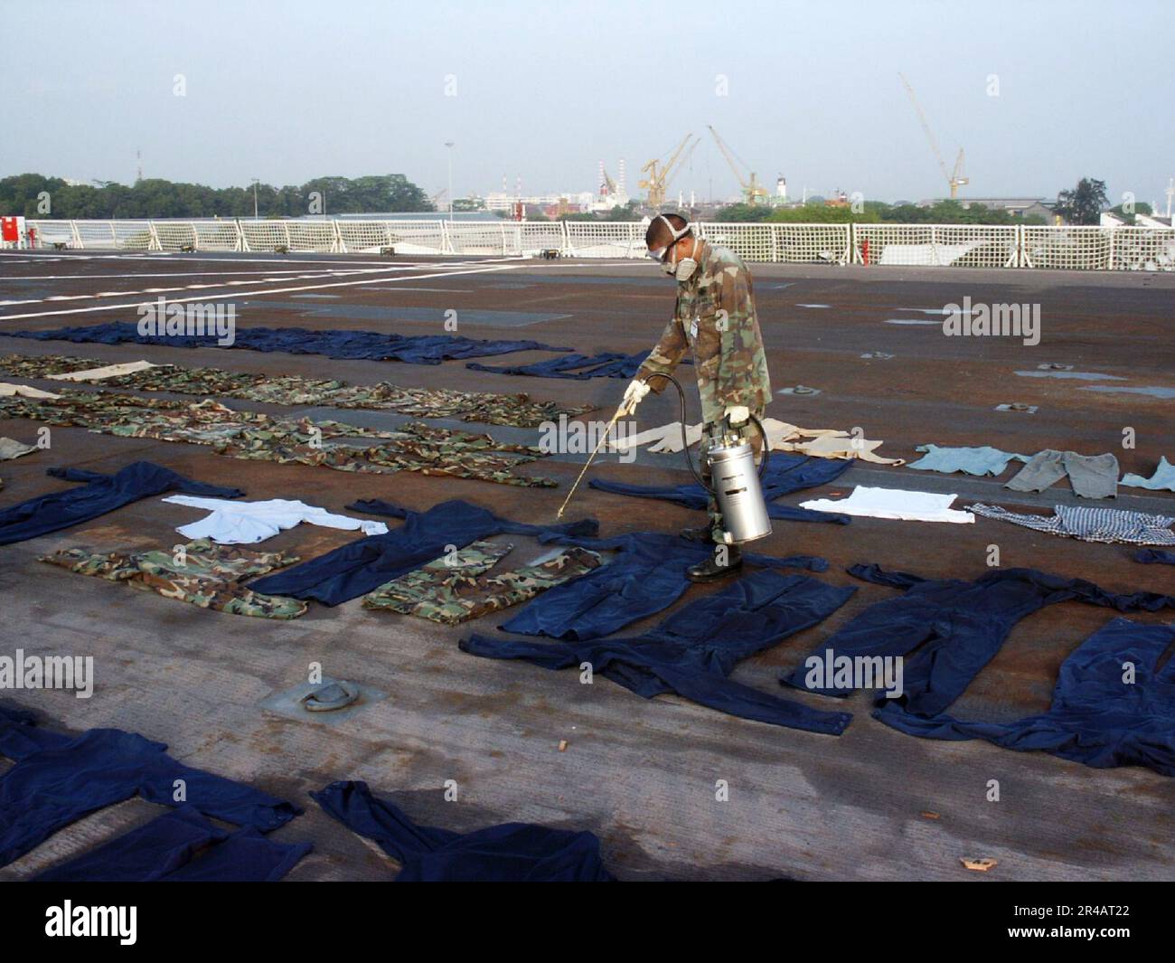 US Navy Hospital Corpsman 2nd Class applies Permethrin insect control ...