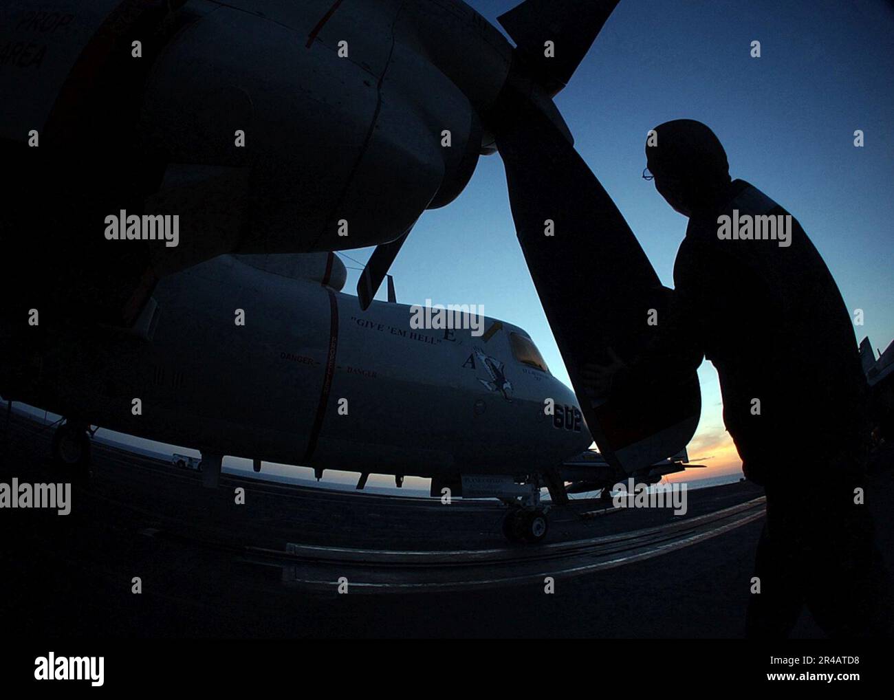 US Navy A Sailor inspects one of the propellers on an E-2C Hawkeye on ...