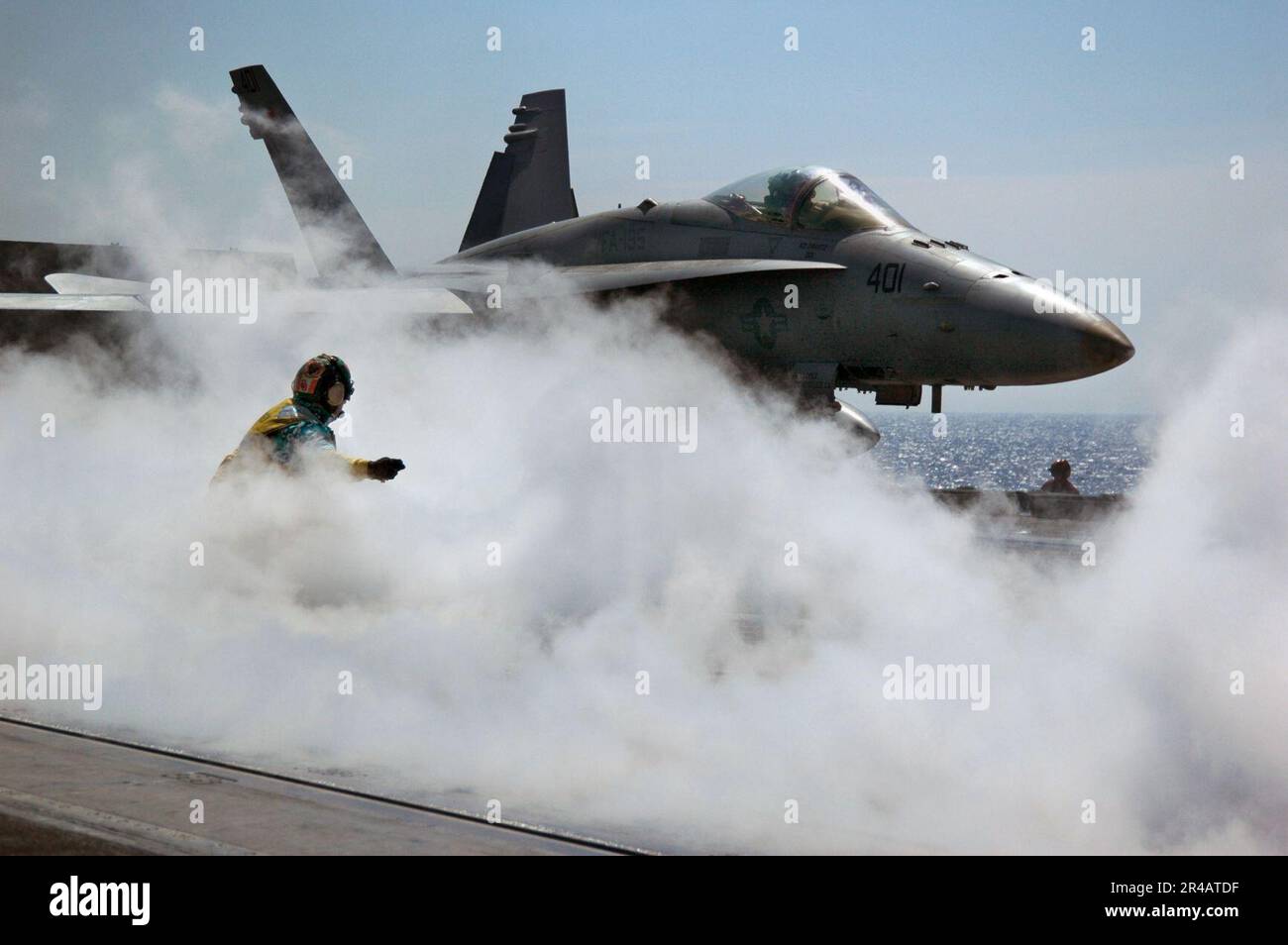 US Navy A catapult shooter launches an F-A-18C Hornet, assigned to the ...