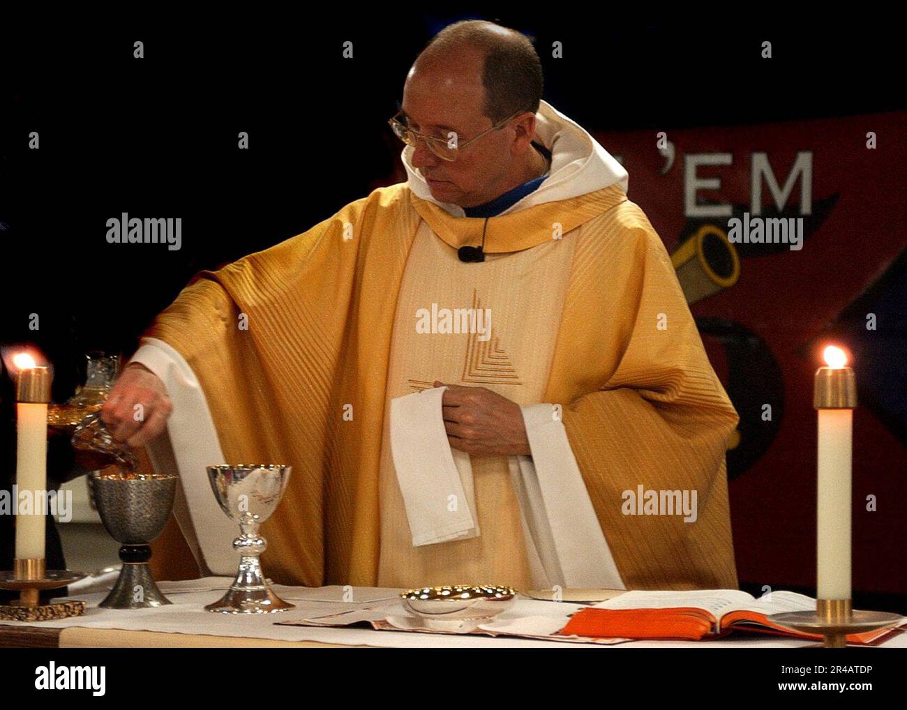 US Navy Chaplain, prepares communion for Easter Mass in the forecastle ...