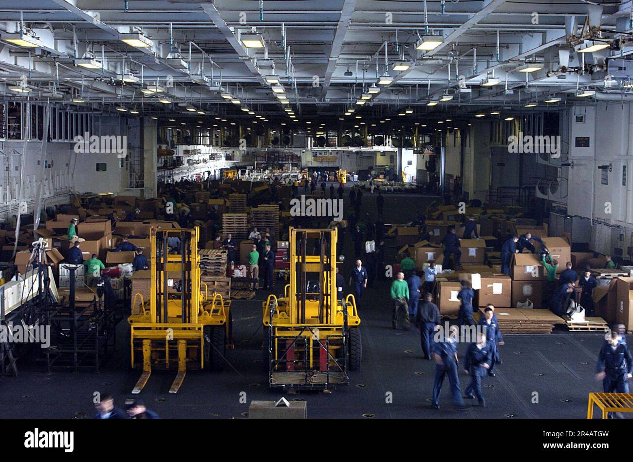 US Navy Carrier Air Wing Five (CVW-5) personnel fill the hangar bay of ...