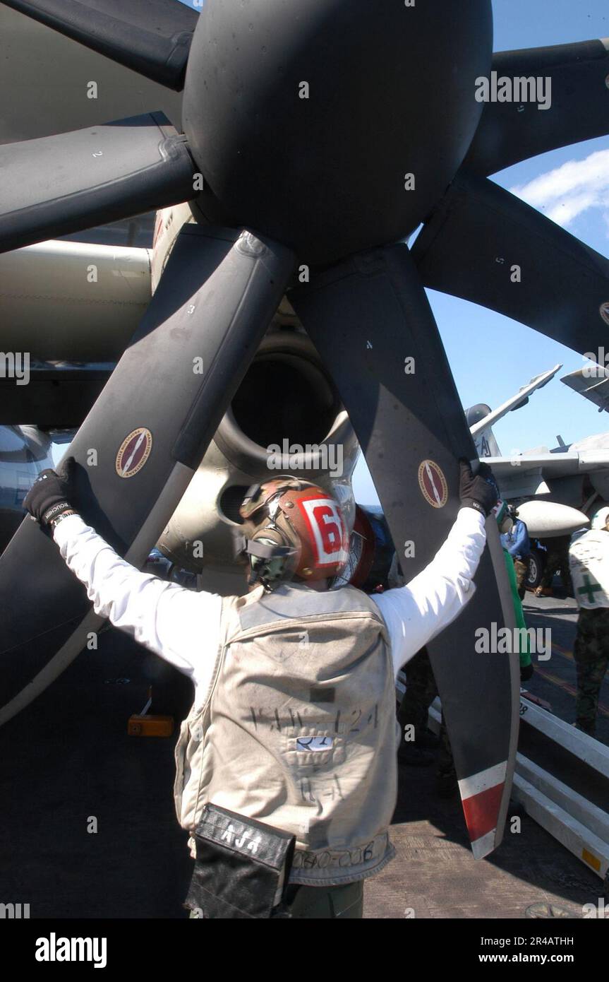 US Navy A squadron quality assurance member inspects the propeller of ...