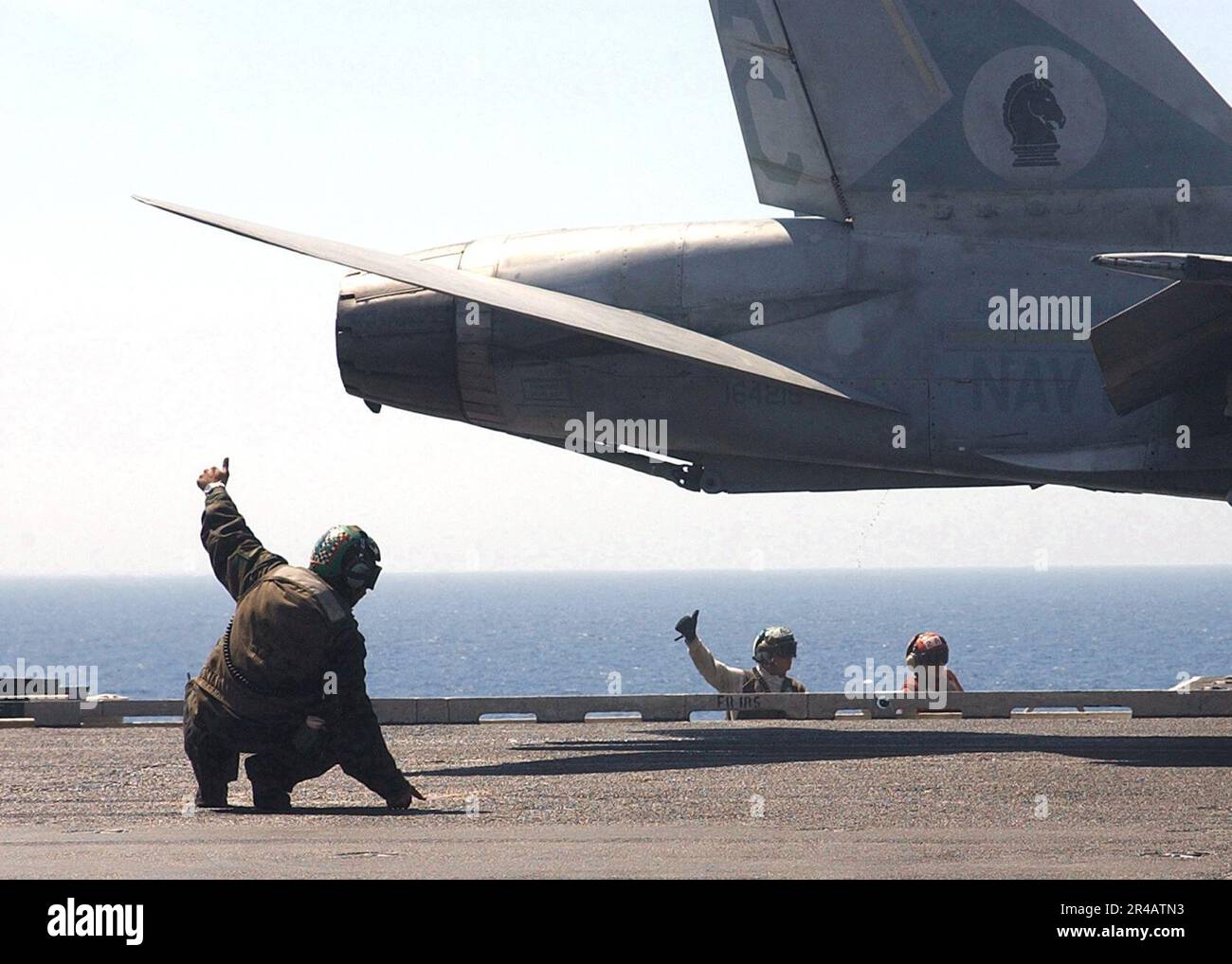 US Navy Final checkers give the clear to launch signal prior to an F-A ...