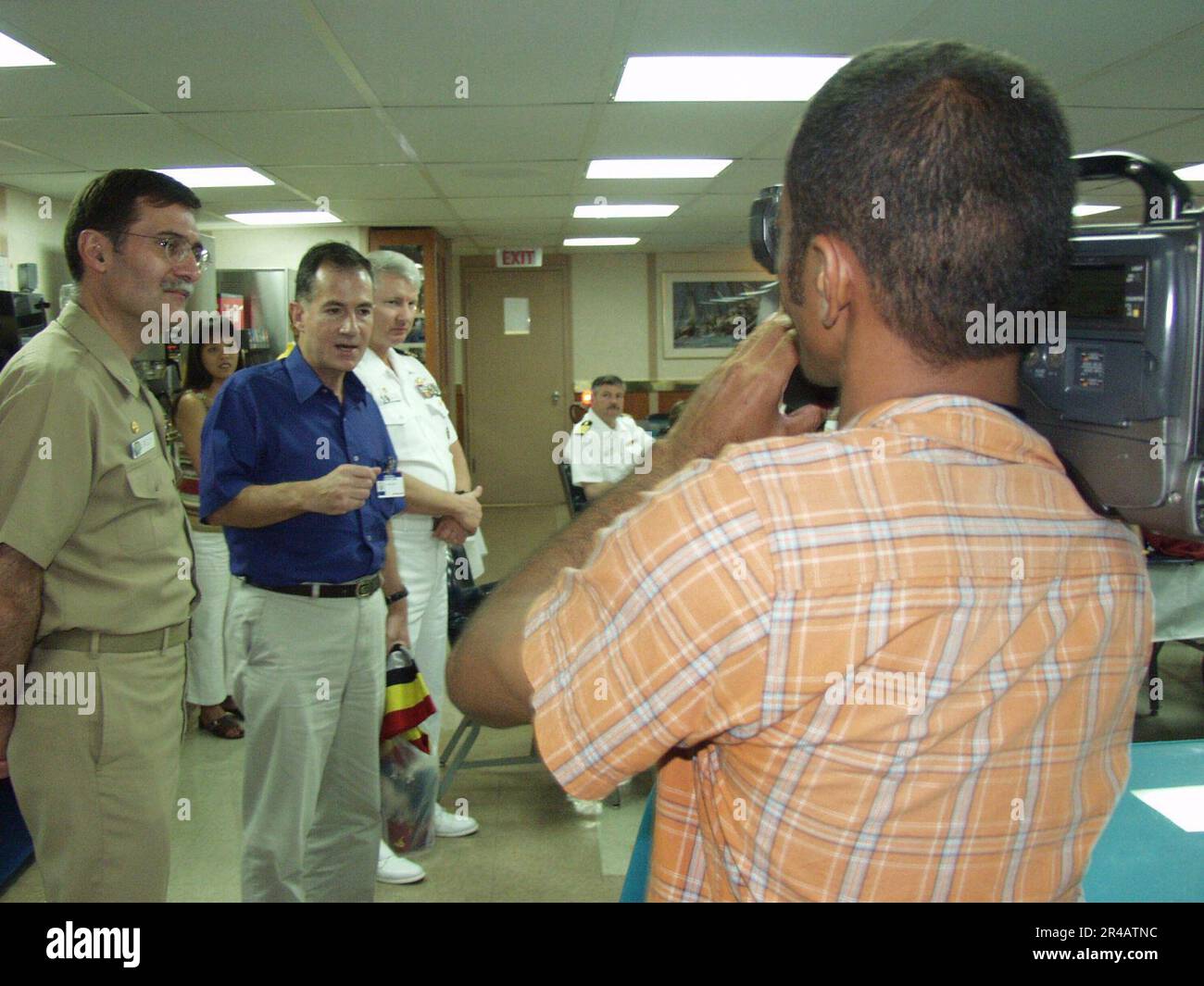 US Navy Commanding Officer, Medical Treatment Facility, left, stands ...