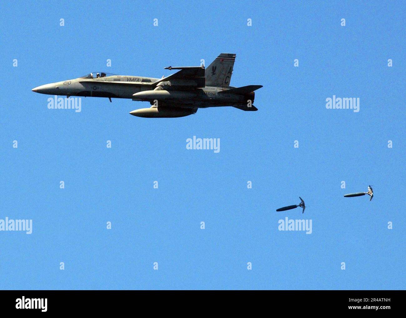 US Navy An F-A-18A- Hornet drops two inert 500 pound Mk-82 general ...