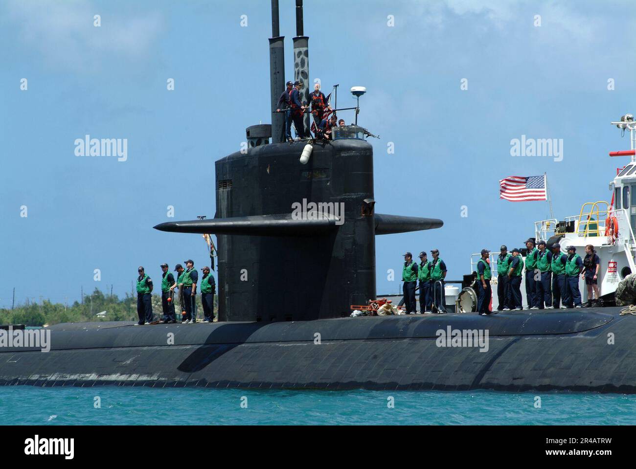 US Navy Sailors man the rails of the fast attack submarine USS Los ...