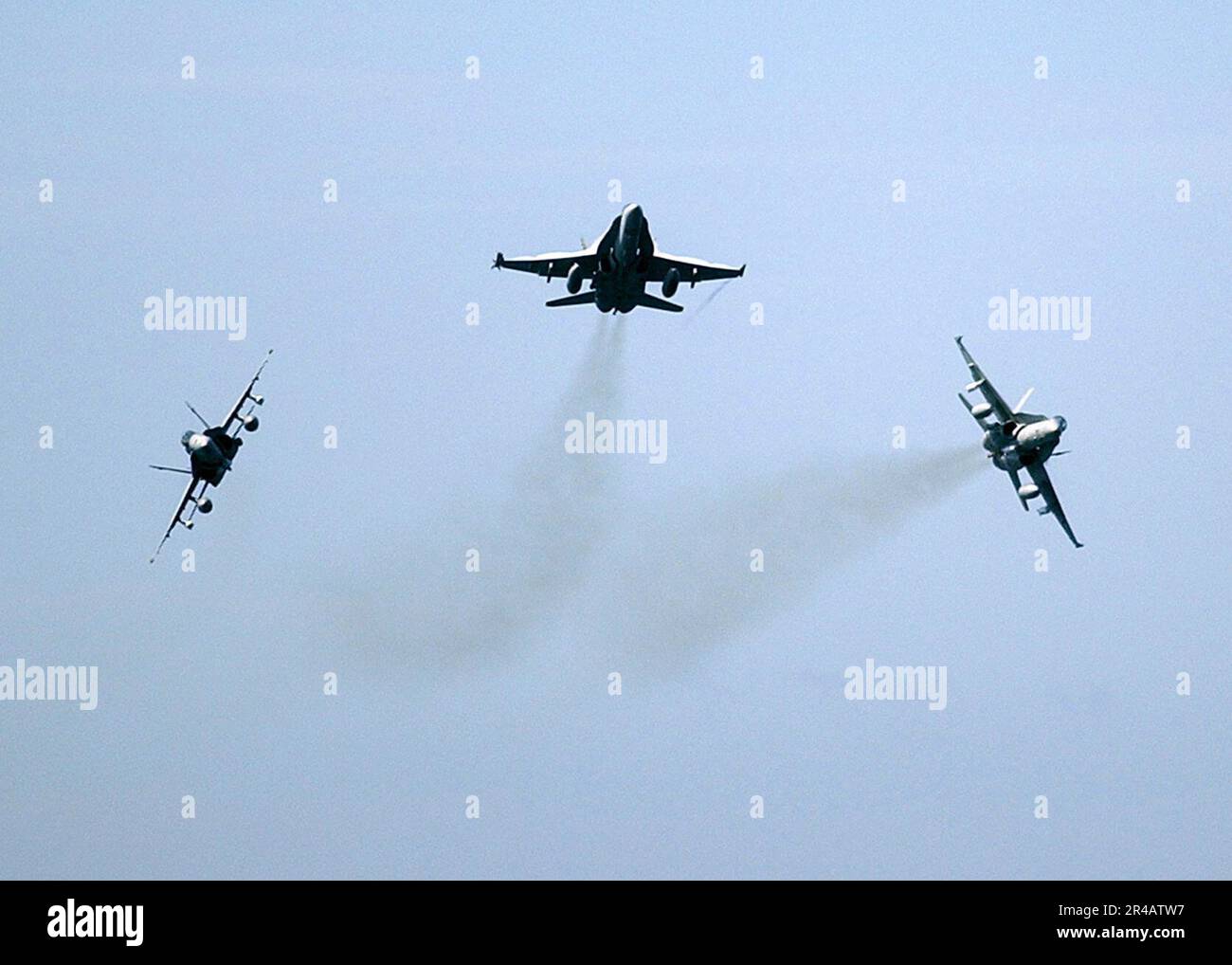 US Navy Three F-A-18 Hornets perform a pitch and roll maneuver Stock ...
