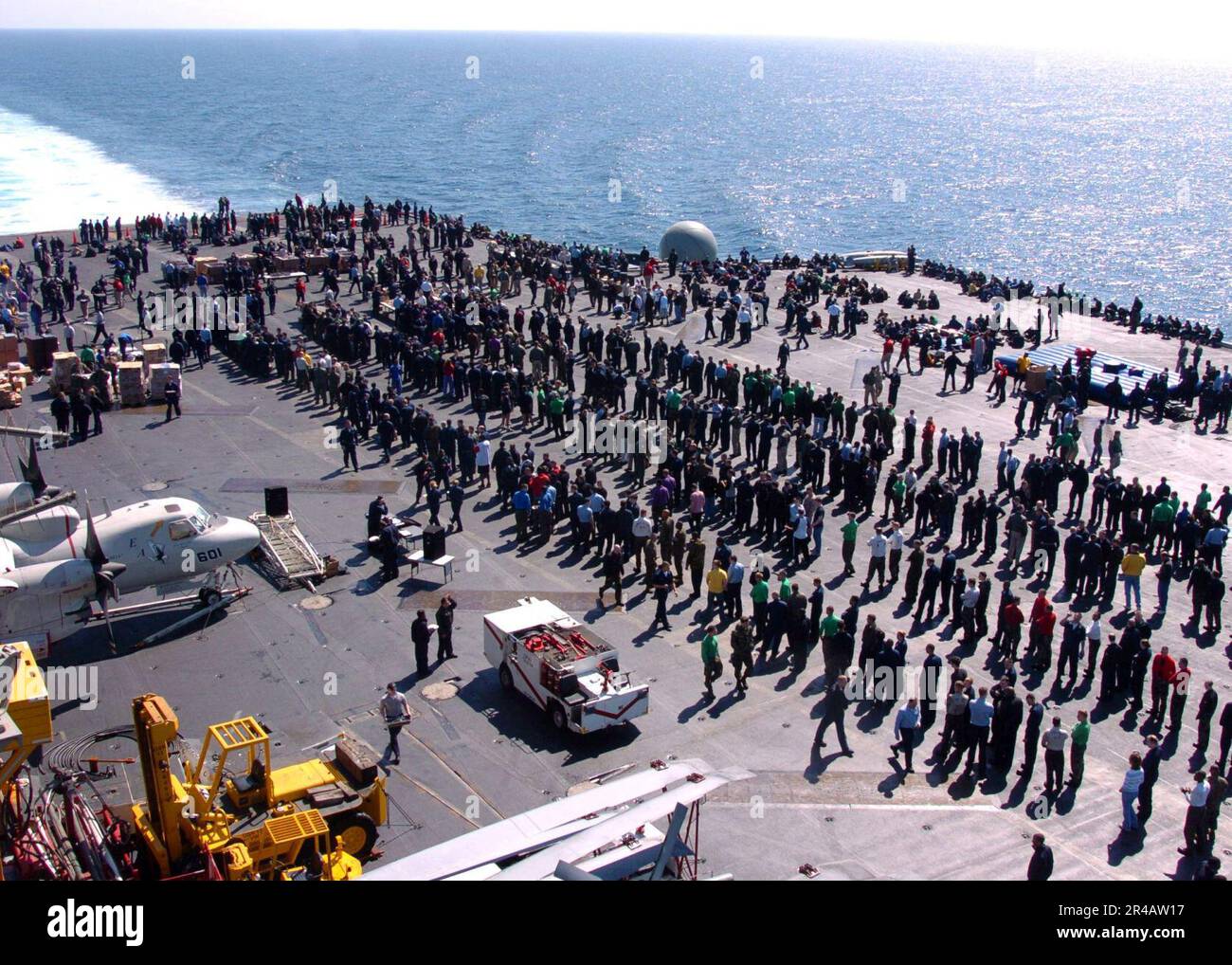US Navy Sailors stand in line for freshly grilled barbeque on the ...