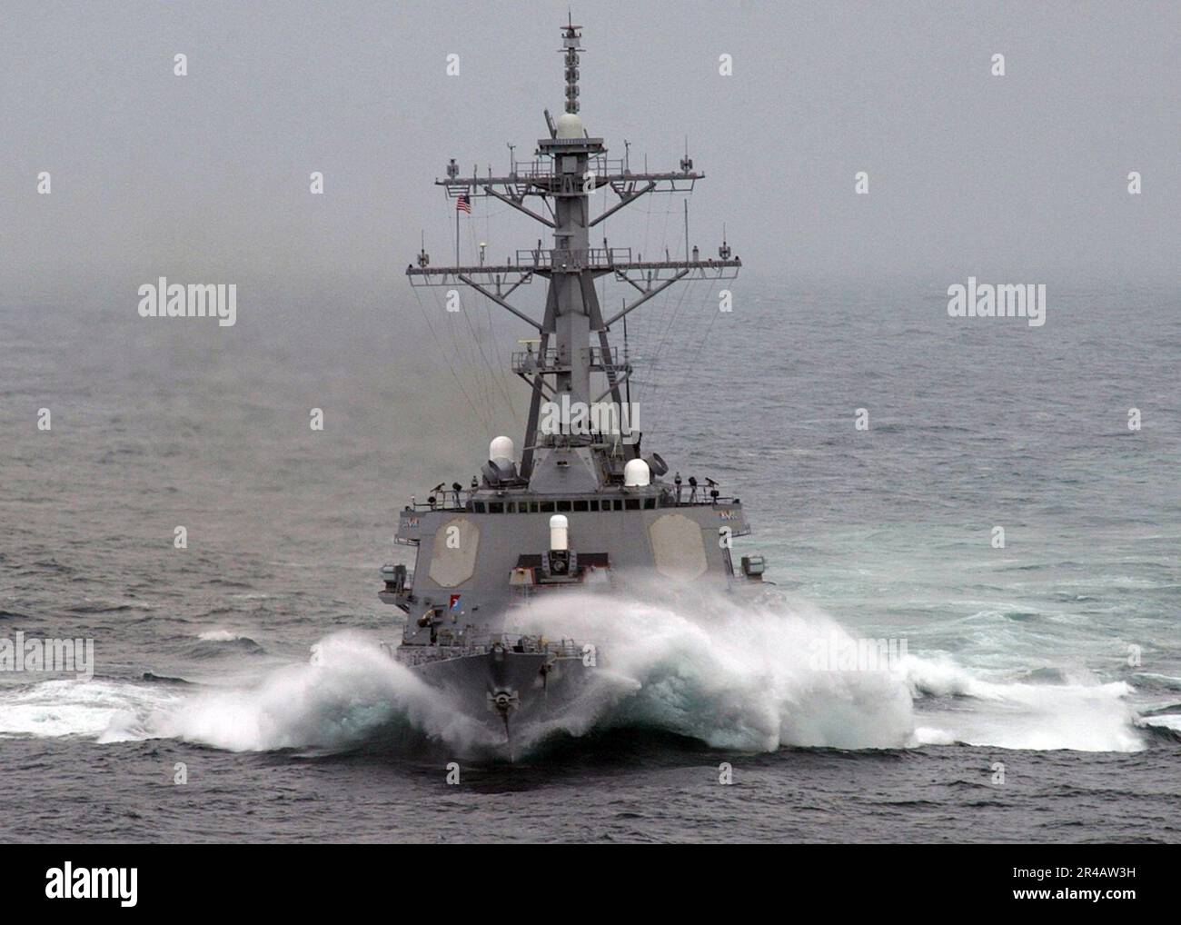 US Navy Waves crash over the bow of the Arleigh-Burke-class guided ...