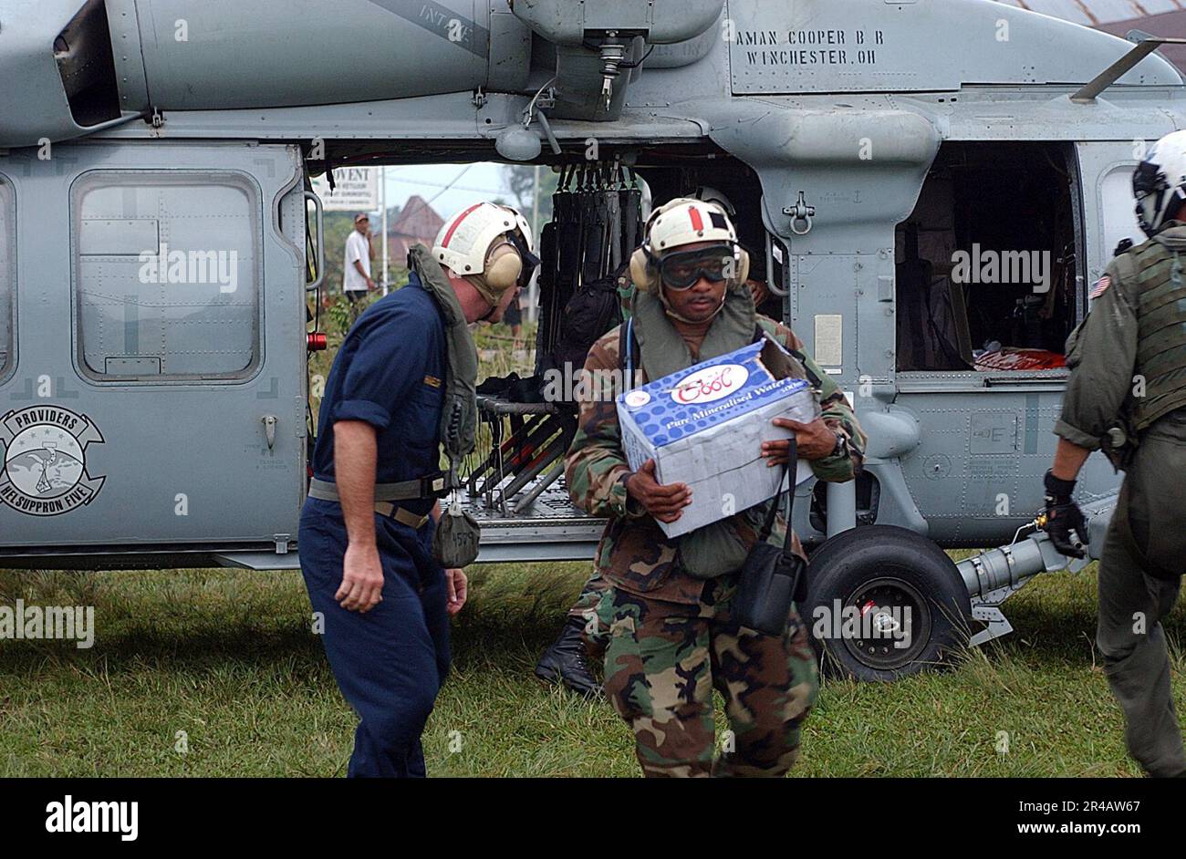 US Navy Lt. Cmdr. center, and medical professionals assigned to the ...