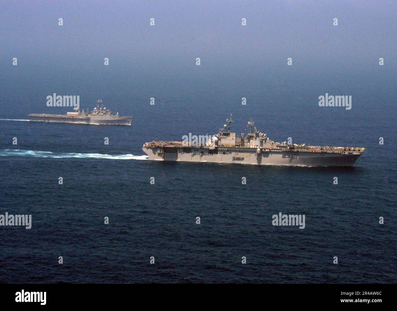 US Navy The amphibious transport dock USS Ponce (LPD 15), left, and the ...