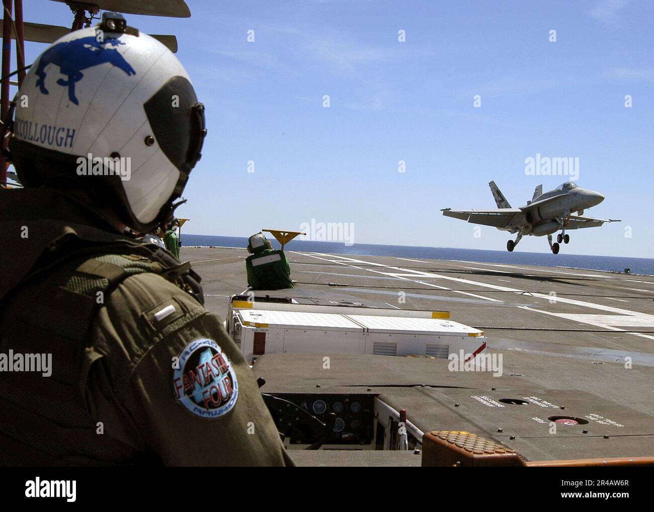 US Navy A Naval Aviator watches as an F-A-18C Hornet as it prepares to ...