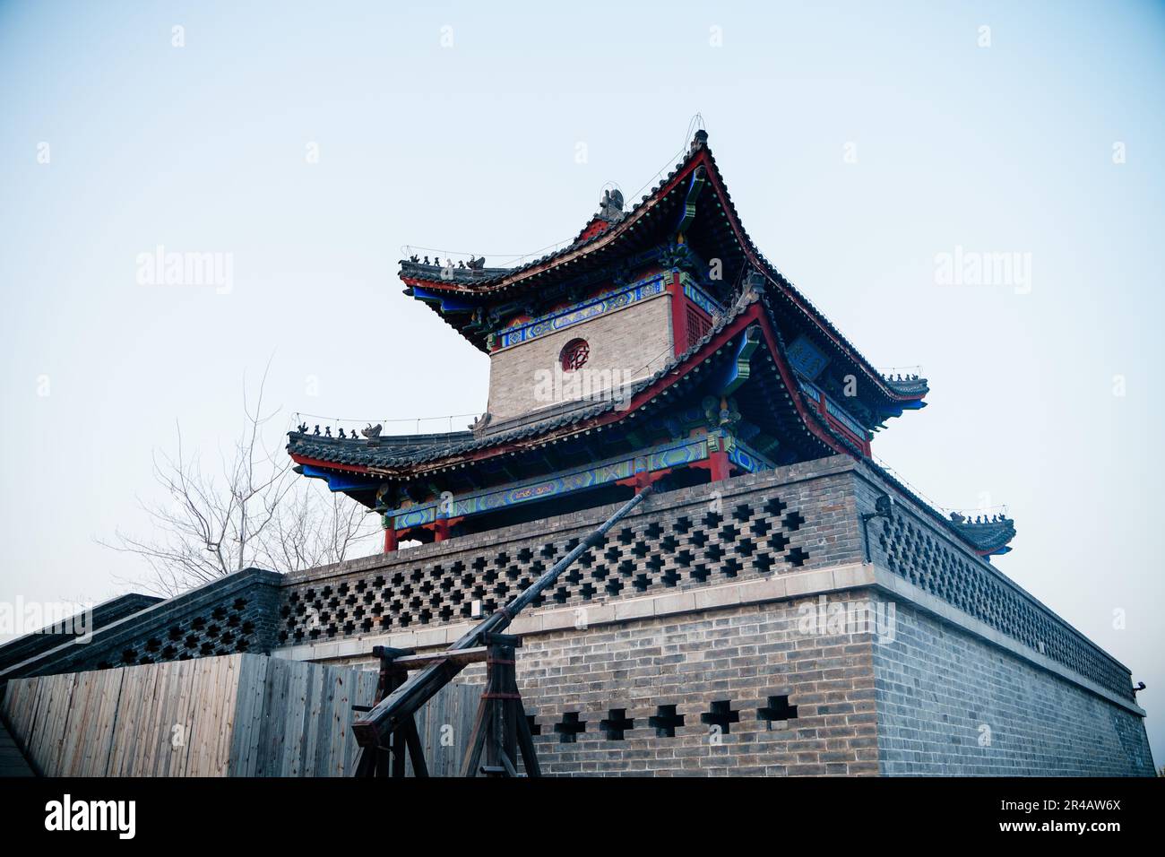 A Chinese traditional wall and fortress ruins adorned with intricate ...
