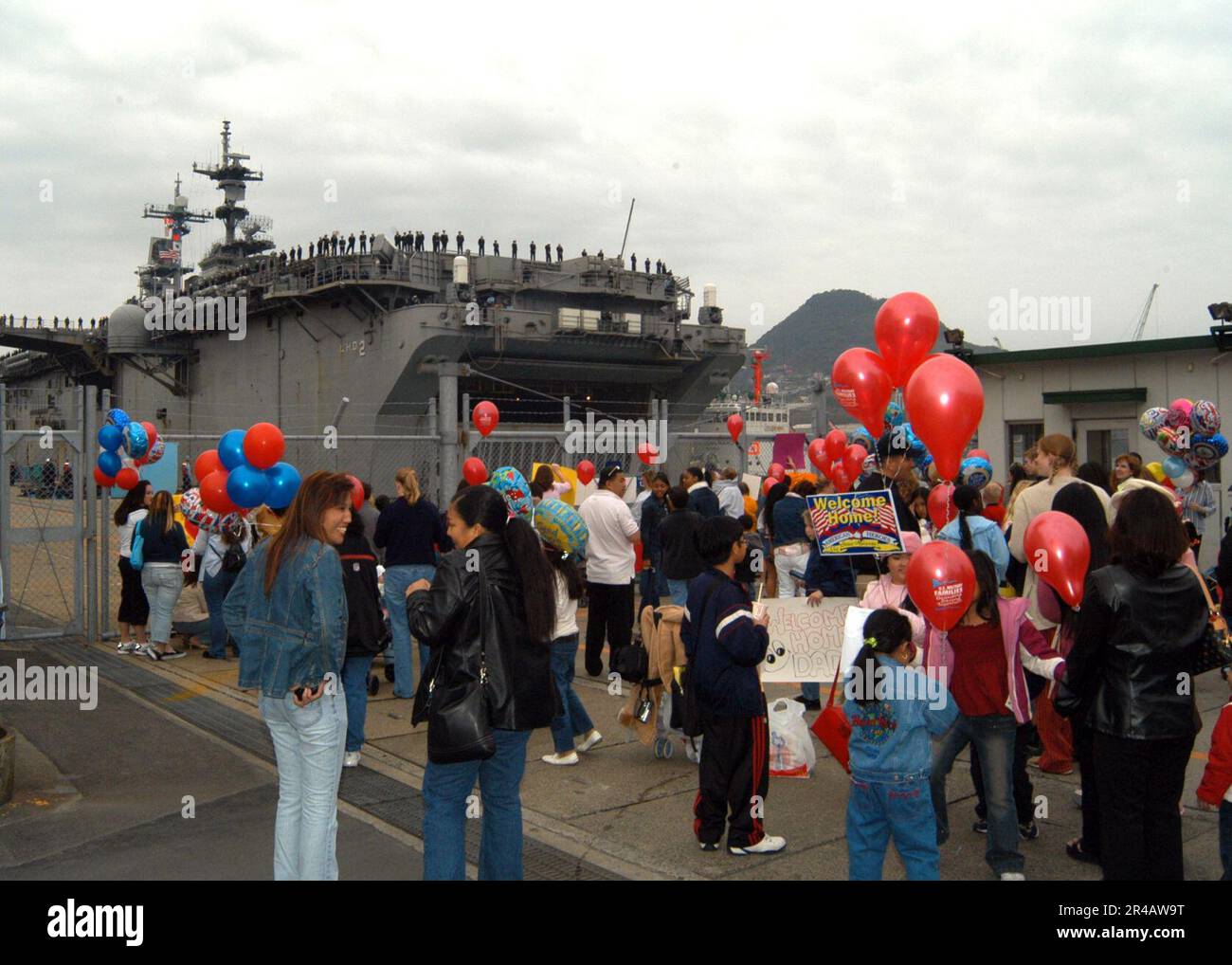 US Navy Friends and family await their Sailors and Marines to disembark ...