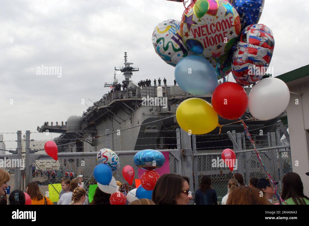 US Navy Friends and family await their Sailors and Marines to disembark ...