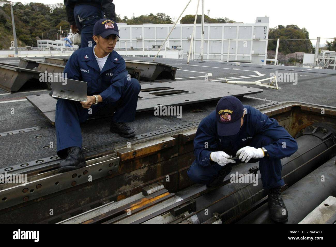 US Navy Air Department personnel calibrate clearance for the water ...