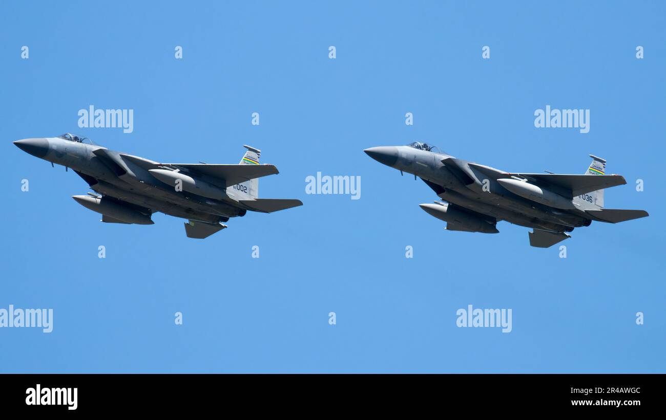 Two airplanes flying in opposite directions towards one another in the ...