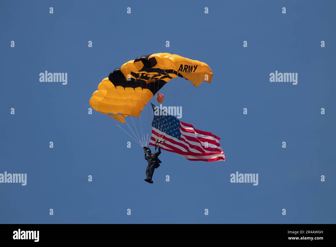 A daring individual skydiving through a picturesque sky with a vibrant ...