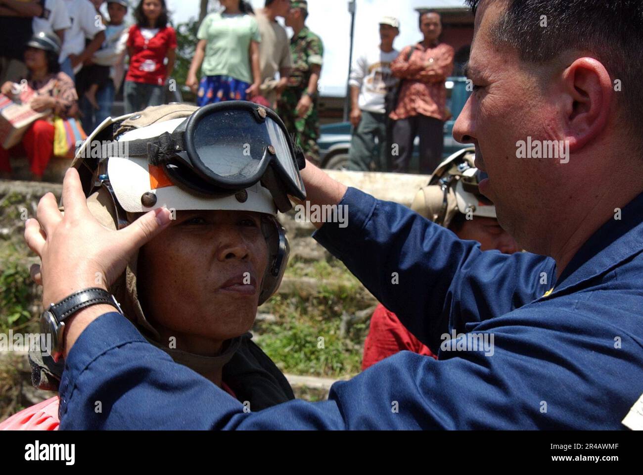 US Navy Lt. Cmdr. ensures that a patient's cranial is properly adjusted ...