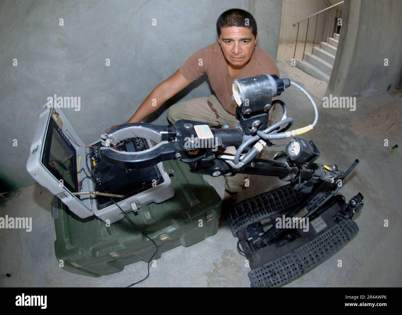 US Navy Chief Quartermaster ensures the retractable arm of the Talon 3B ...